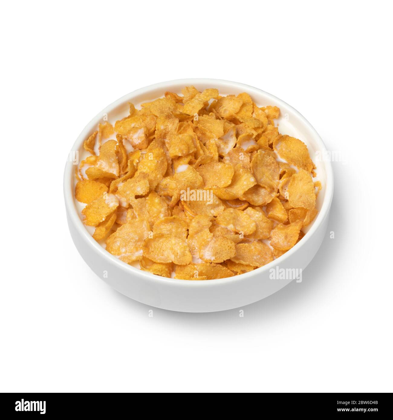 Bowl with traditional cornflakes close up isolated on white background ...