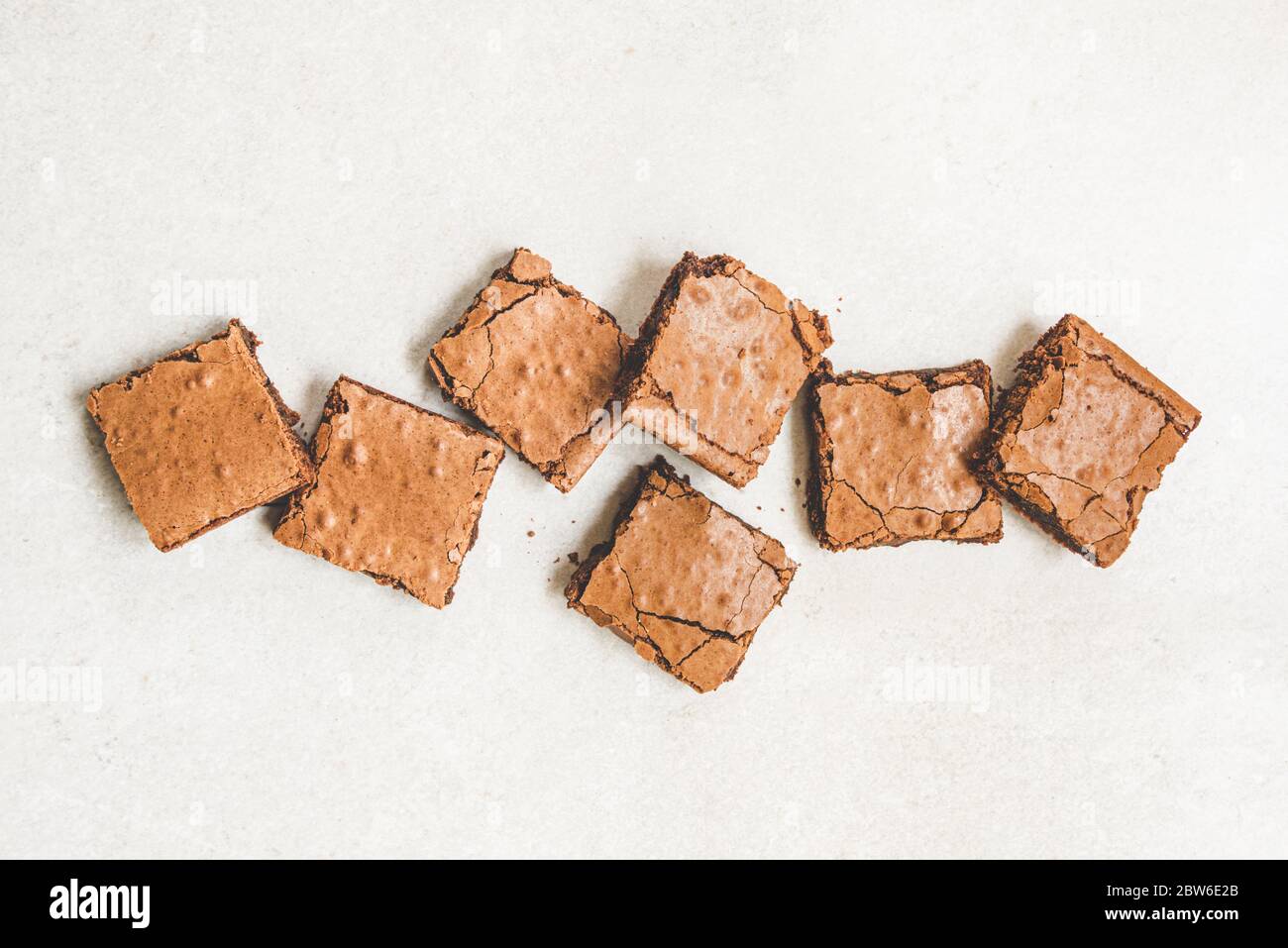 Top view of freshly baked home made brownie cake cut in squares over ...