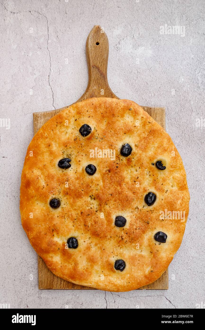Homemade italian focaccia in rustic style on stone background. Healthy ...