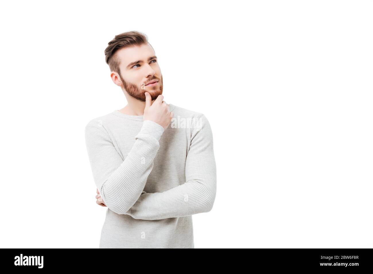 Pensive curious man looking up in thinking pose trying to make choice ...