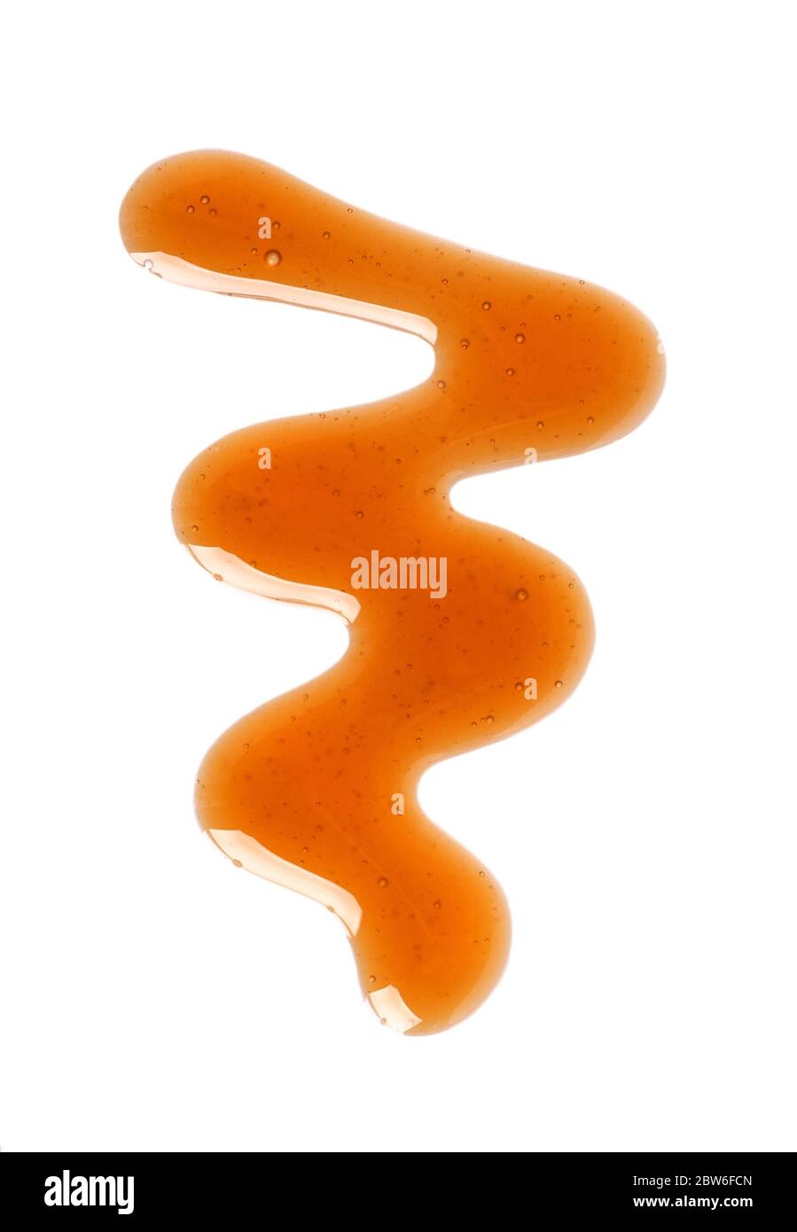 Caramel Syrup Drizzle Isolated On White Background Splashes Of Sweet