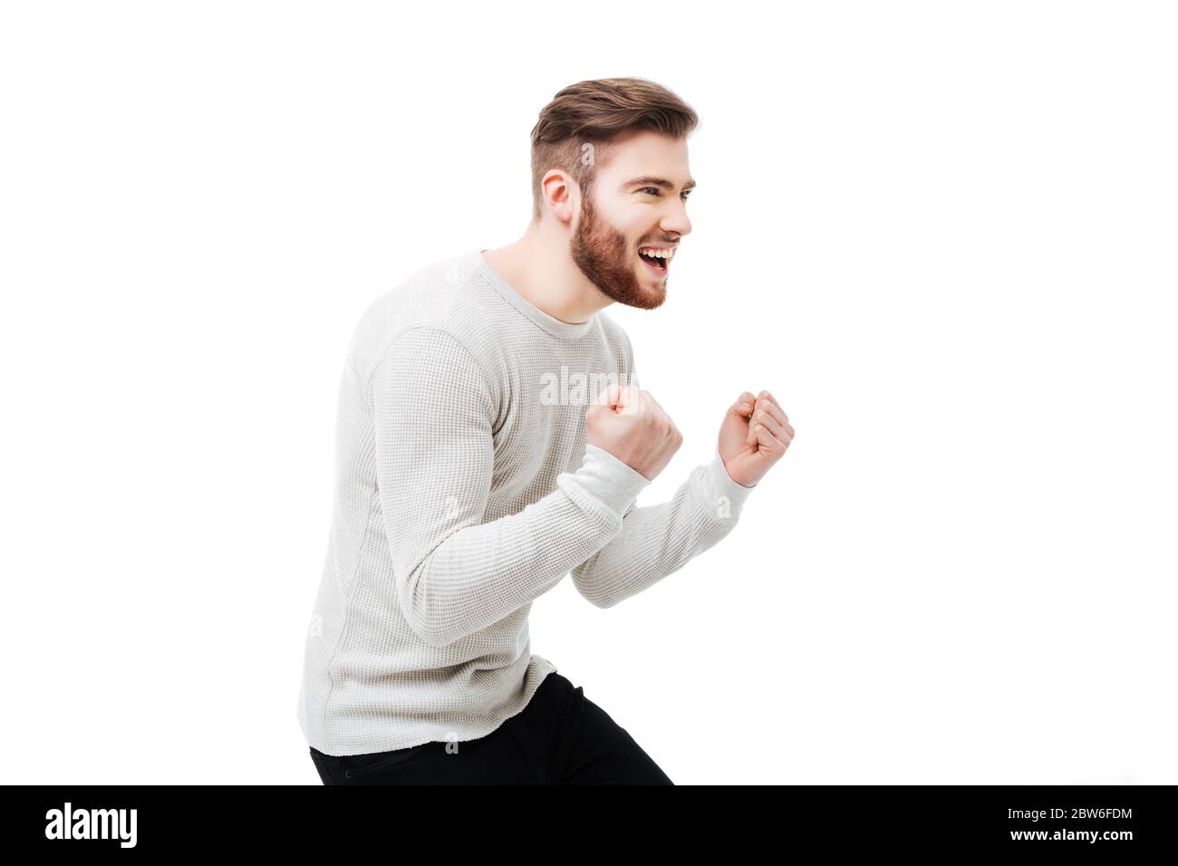 Young man celebrating the win with yes gesture. Guy celebrating the win ...