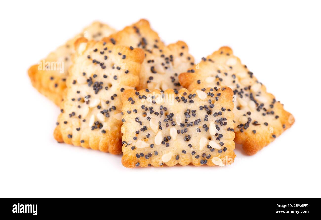 Square poppy seeds and sesame crackers isolated on white background. Dry cracker cookies ...
