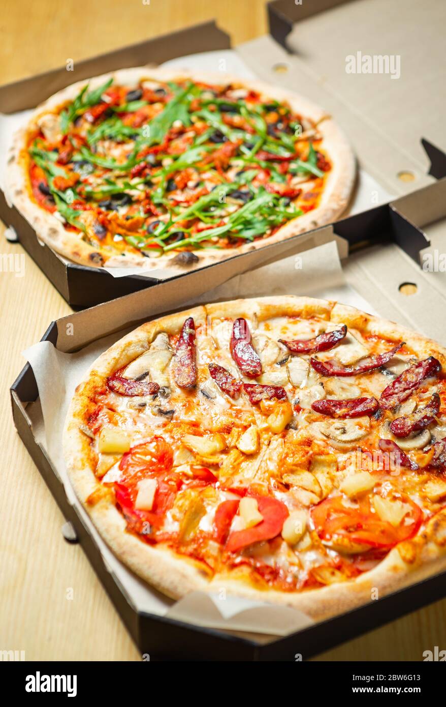 Two Italian pizzas delivered in cardboard boxes.Pineapple pizza ...