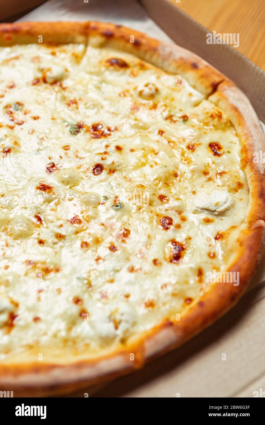 Fresh baked pizza with four cheeses.Delicious Italian fast food with ...