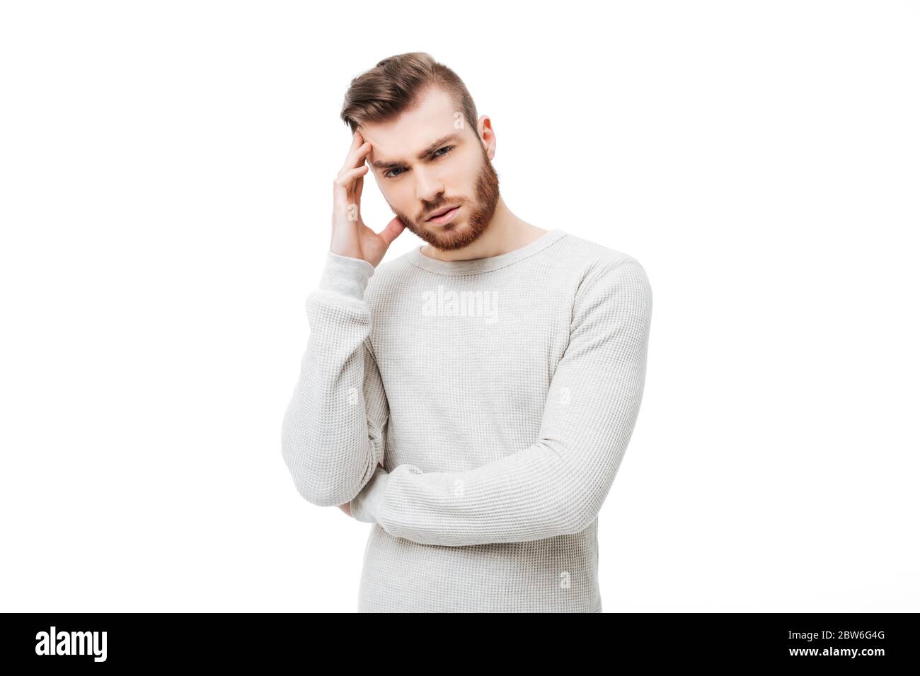 Young man with headache or thinking hand gesture isolated Stock Photo ...