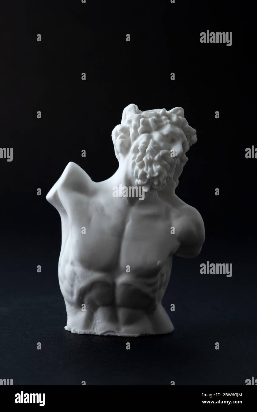 plaster figure in black background Stock Photo - Alamy