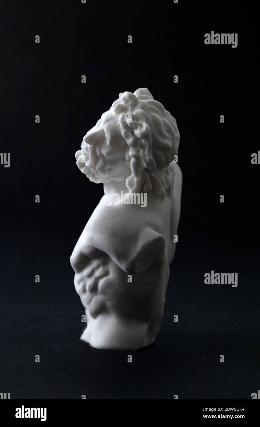 plaster figure in black background Stock Photo - Alamy