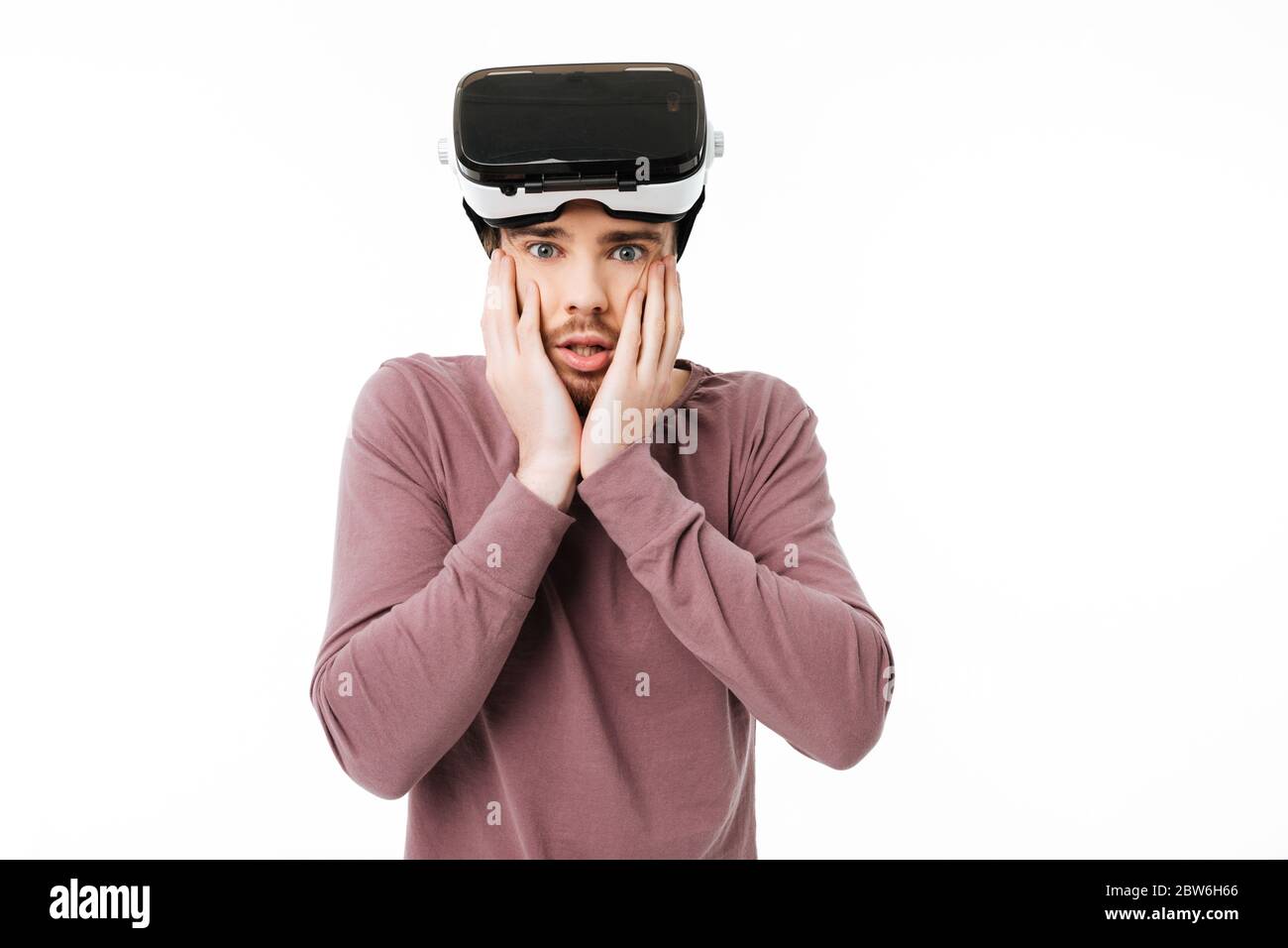 Young boy amazedly looking in camera with visual reality glasses on ...