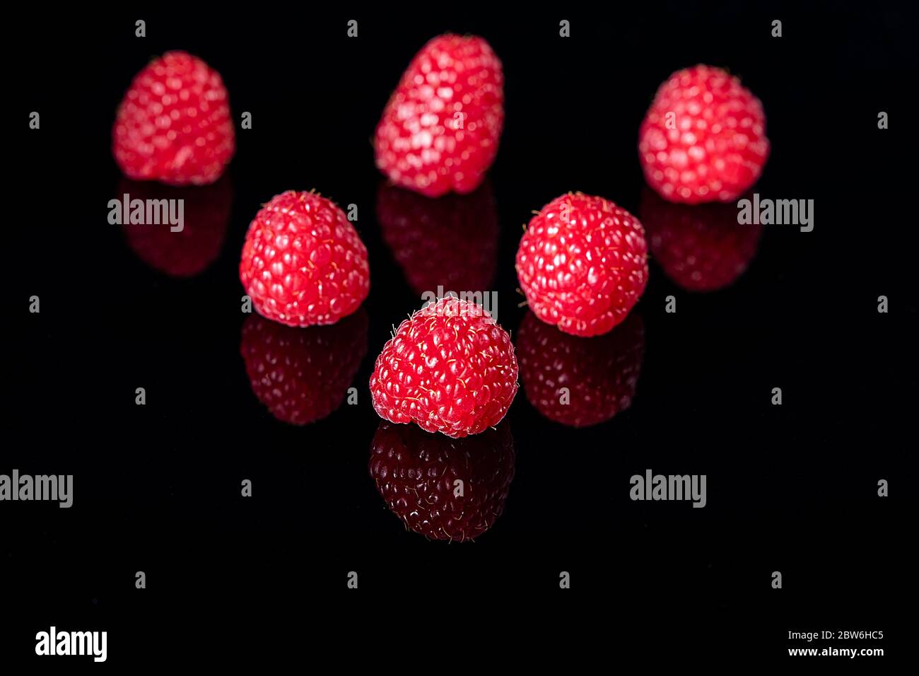 Rapsberry on black background with reflection Stock Photo - Alamy