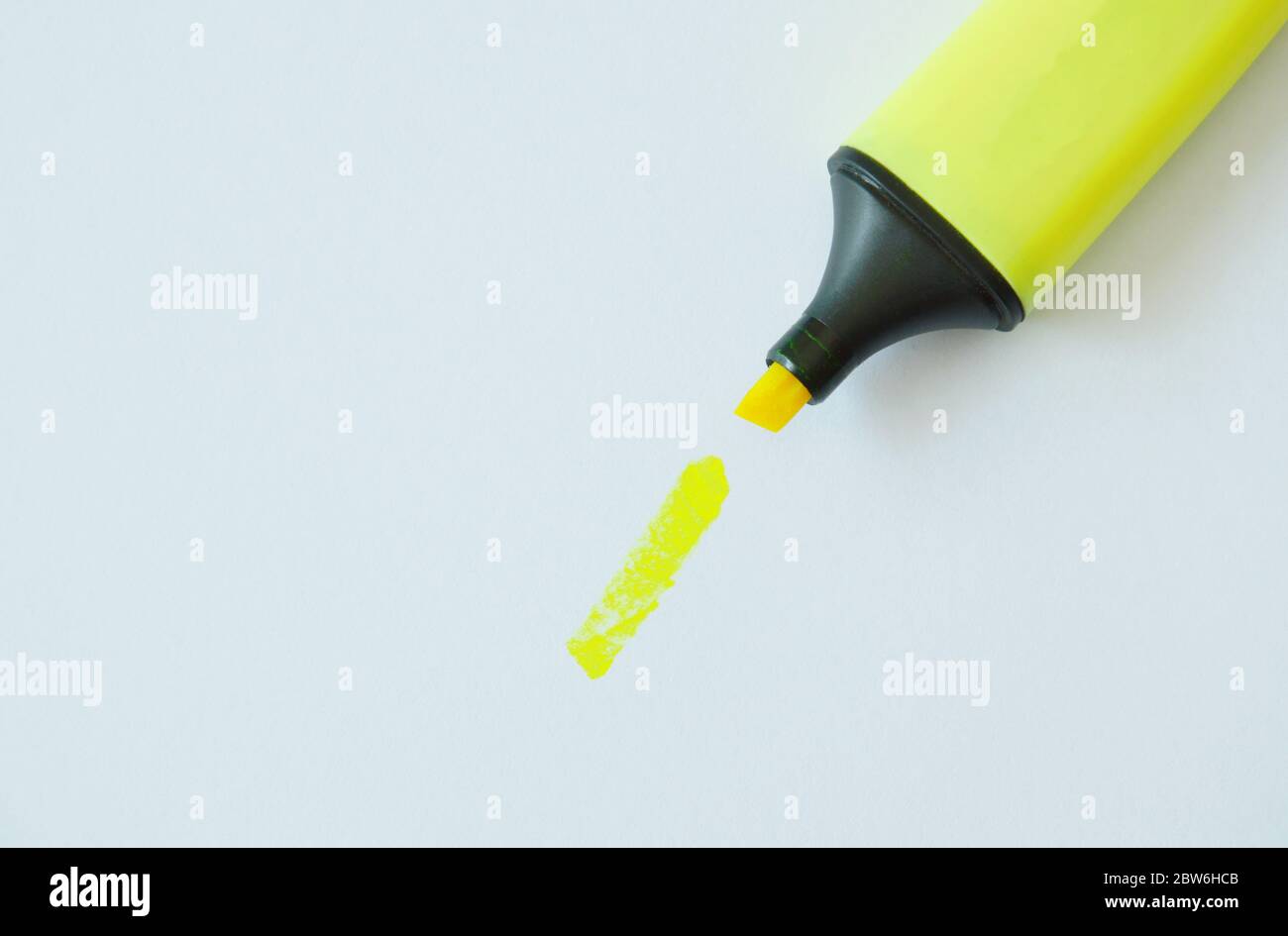 yellow highlight pen make line on white paper Stock Photo - Alamy