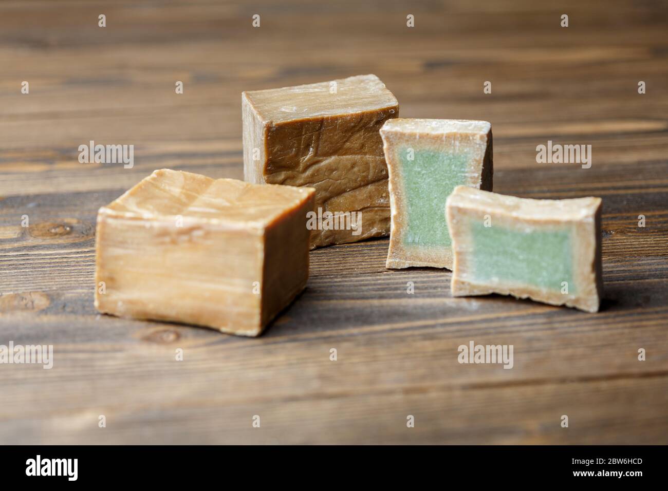 Two bars and slices of traditional aleppo organic laurel soap on a ...