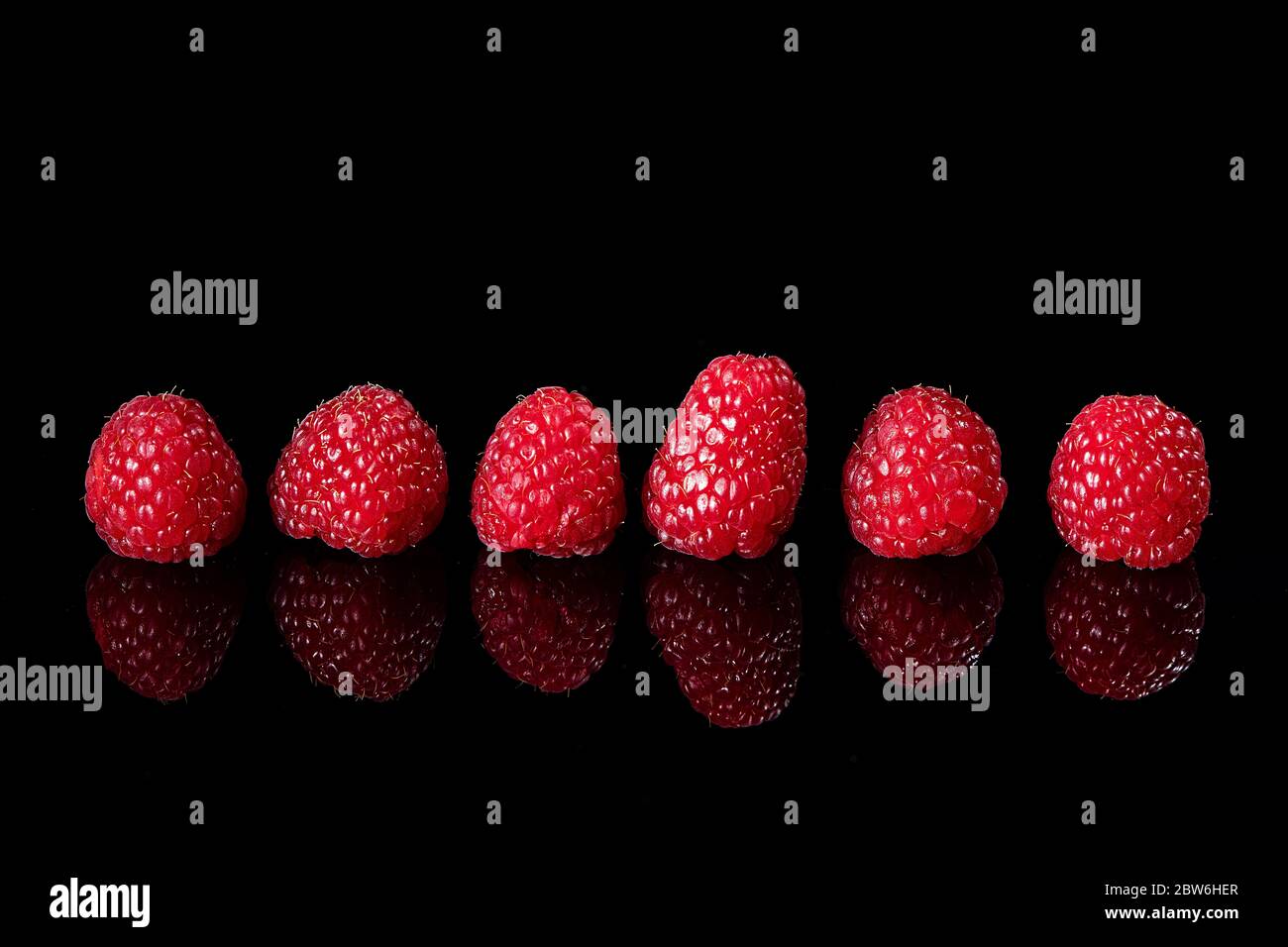 Rapsberry on black background with reflection Stock Photo - Alamy