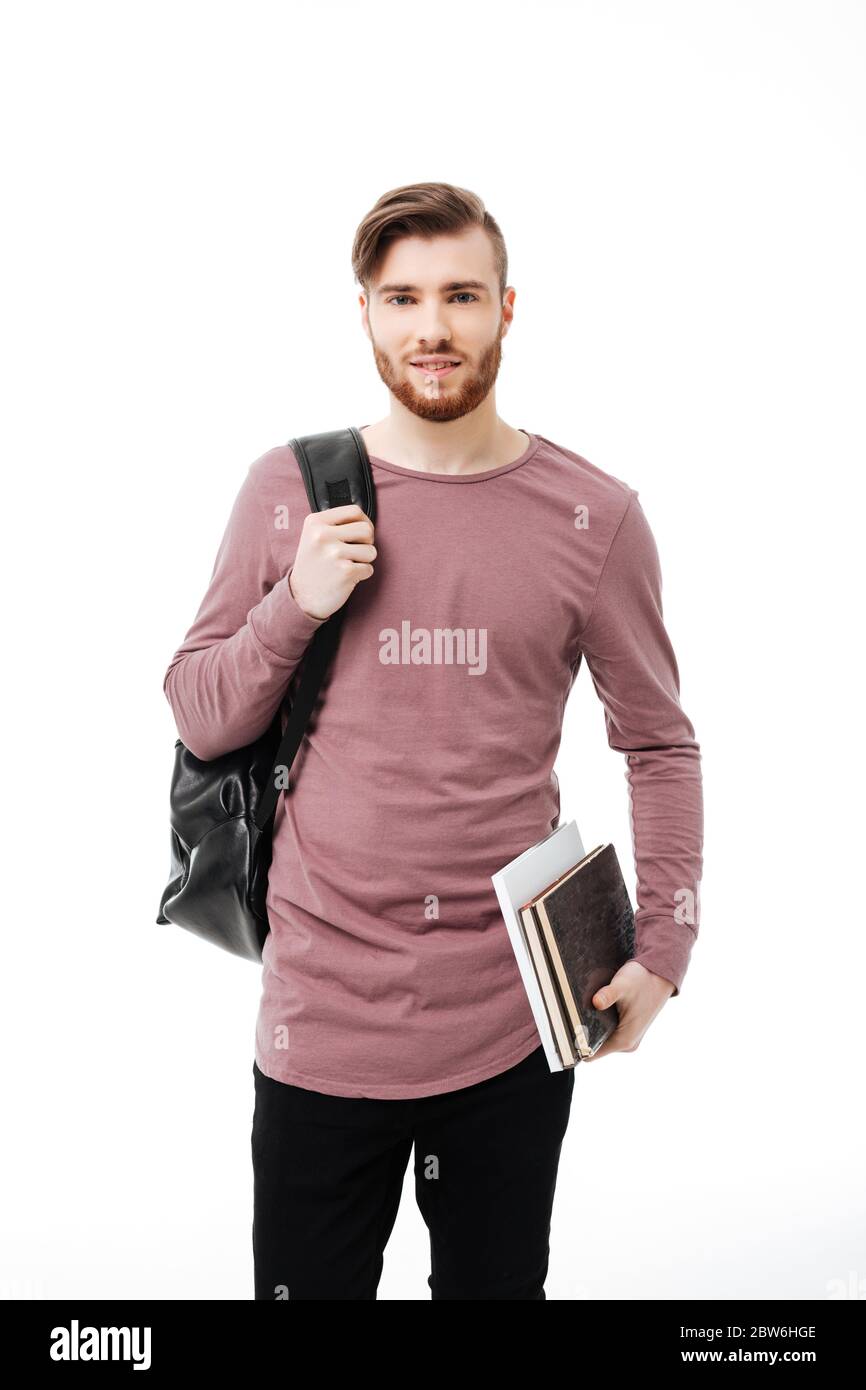 Handsome male student carrying books and a backpack isolated Stock ...