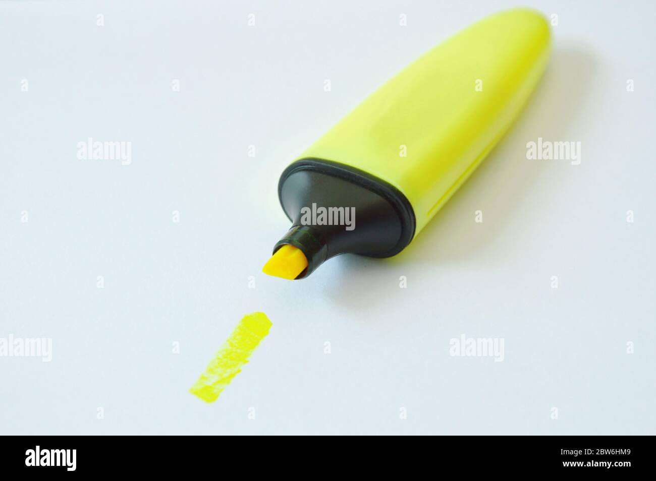 yellow highlight pen make line on white paper Stock Photo - Alamy