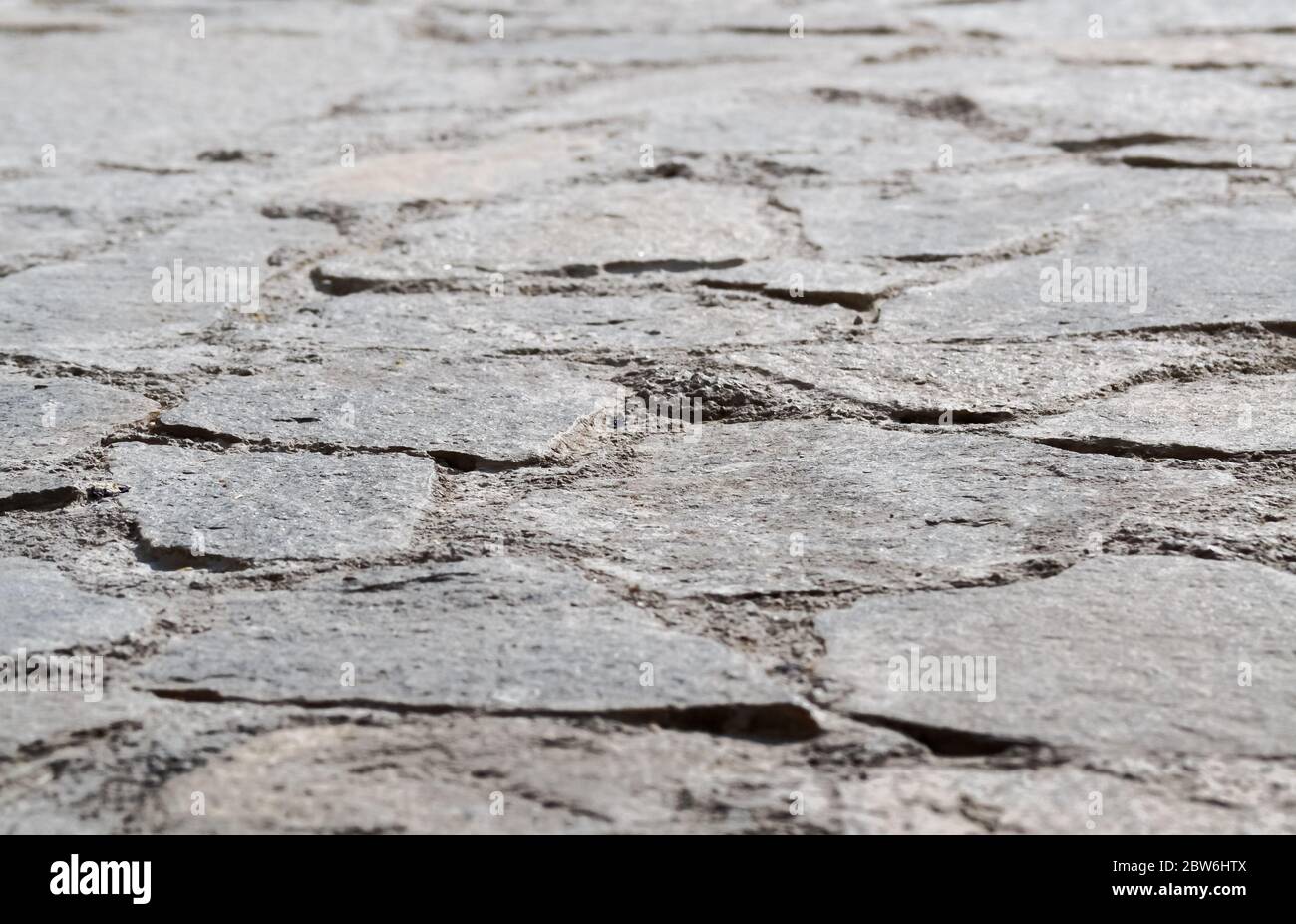 Detail of an old pavement seen from low perspective Stock Photo - Alamy