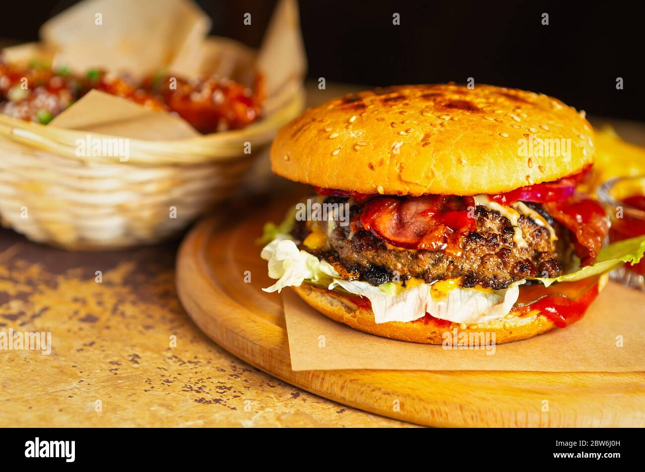 American fast food restaurant.Hamburger served on wooden plate in diner ...