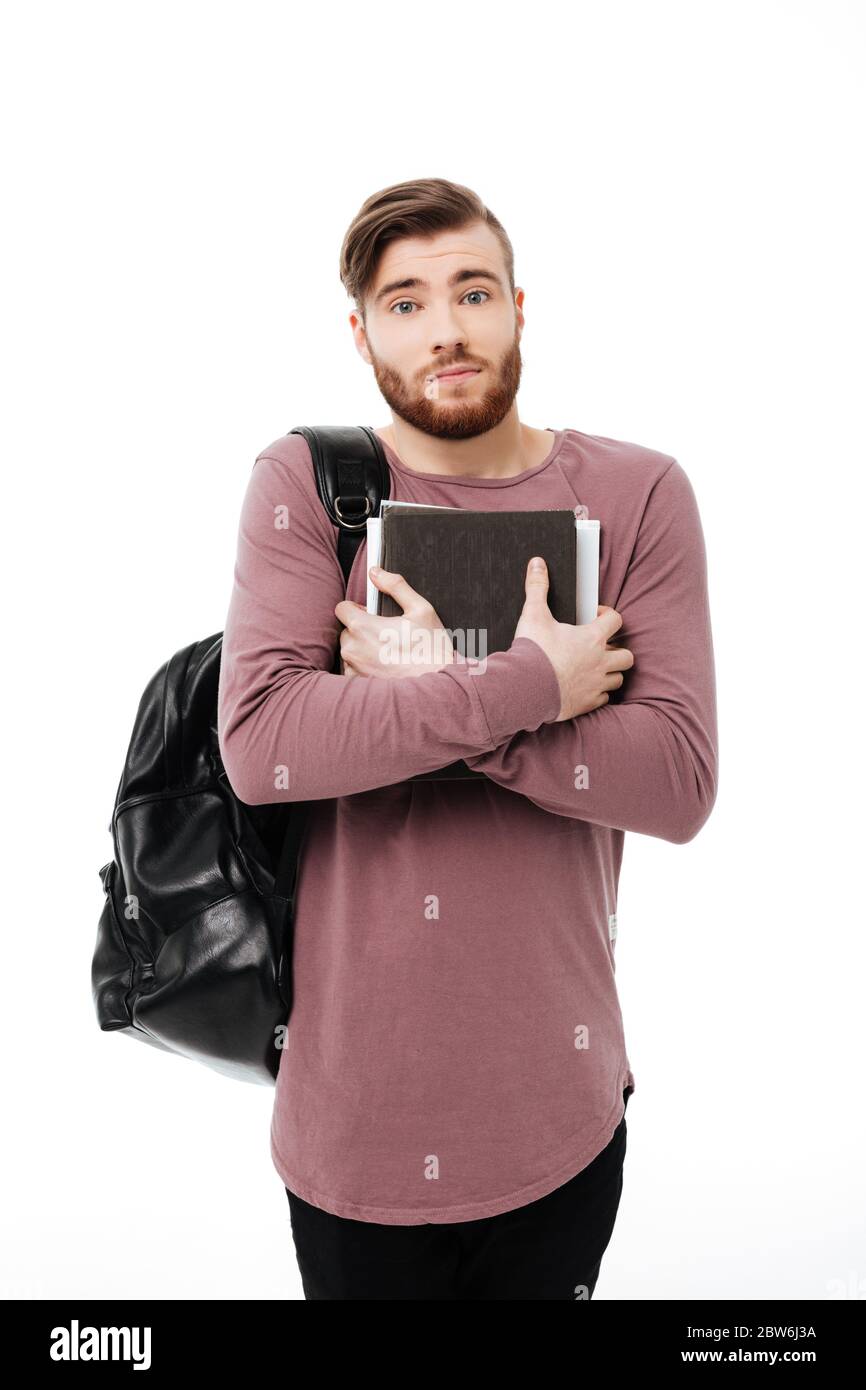 Embarrassed male student carrying books and a backpack isolated Stock ...