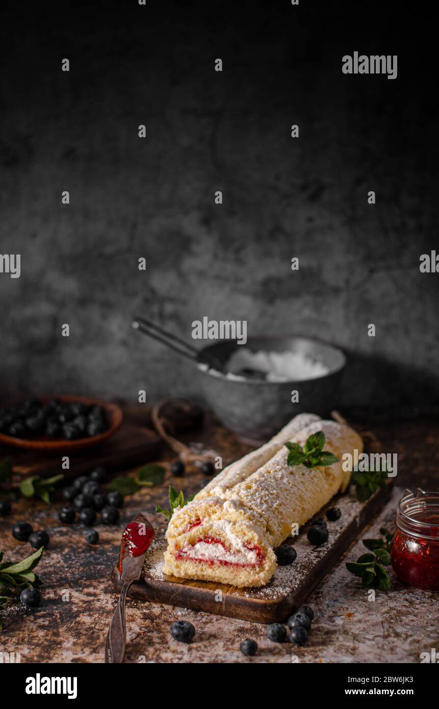 Sweet creamy roulade with berries, forest fruit and mint Stock Photo ...