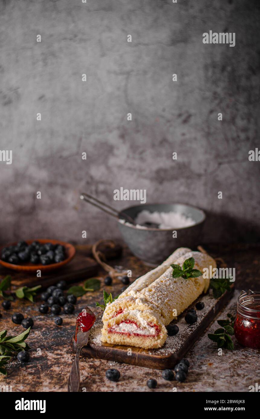Sweet creamy roulade with berries, forest fruit and mint Stock Photo ...