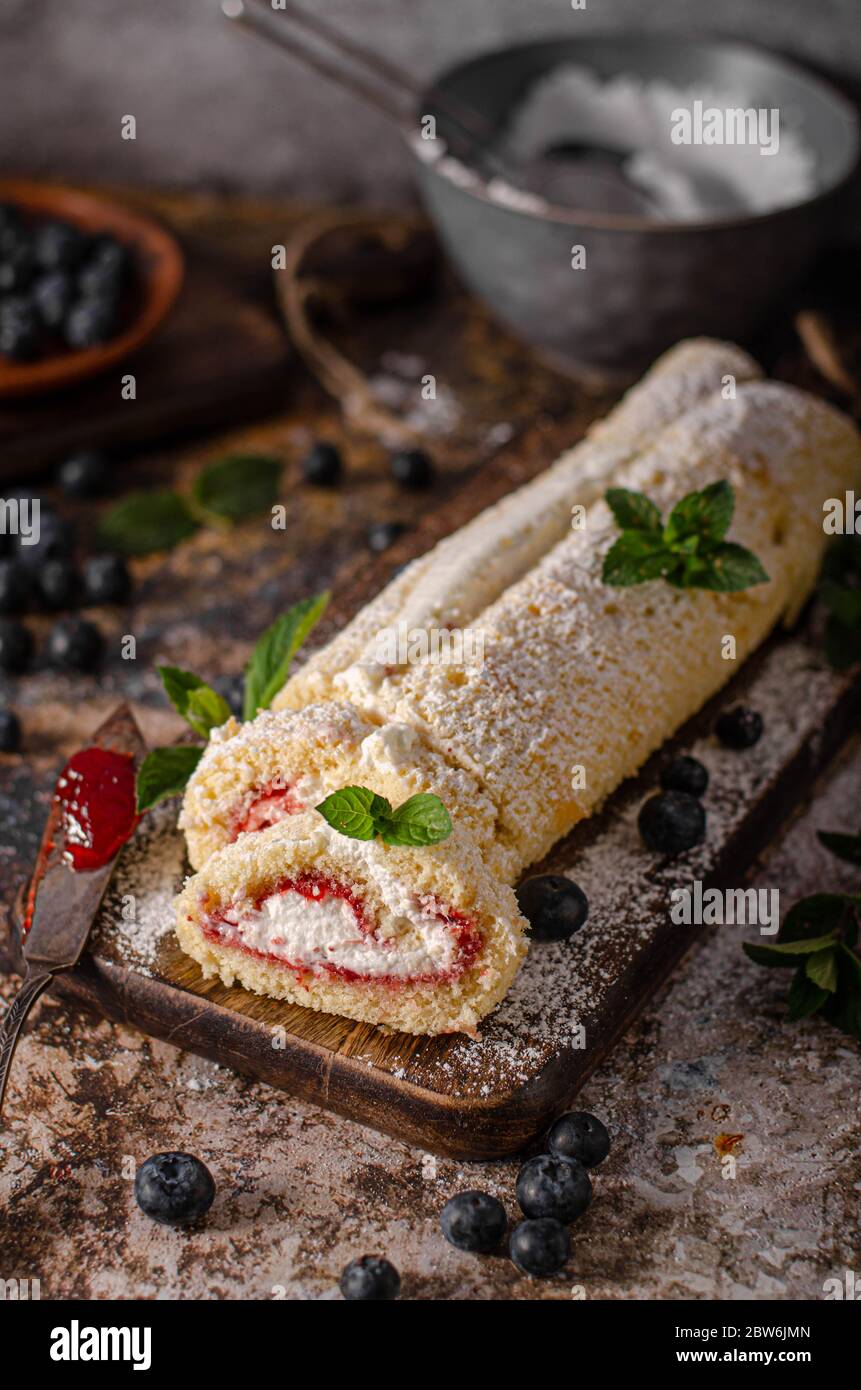 Sweet creamy roulade with berries, forest fruit and mint Stock Photo ...