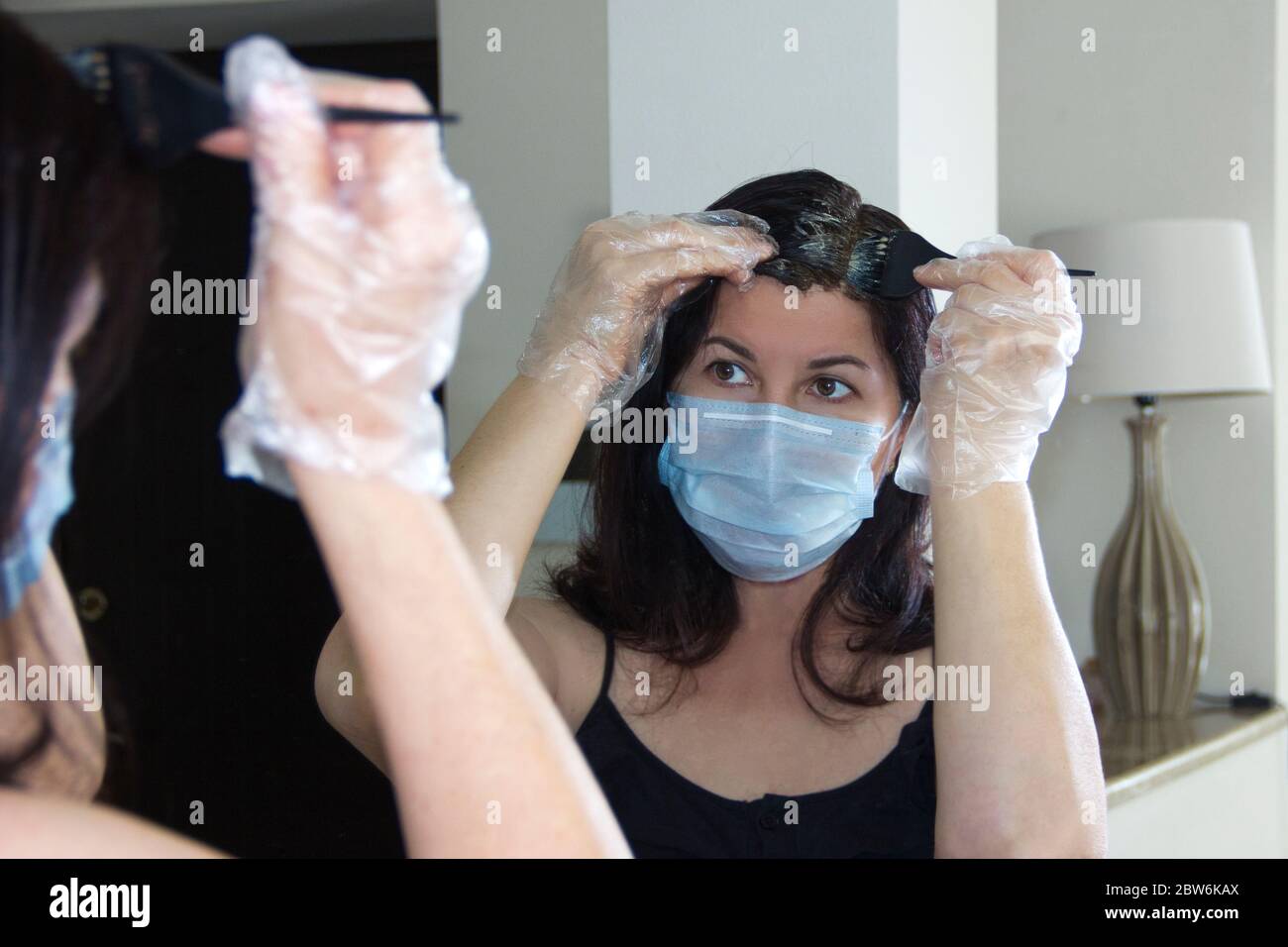 Applying hair mask hi-res stock photography and images - Alamy