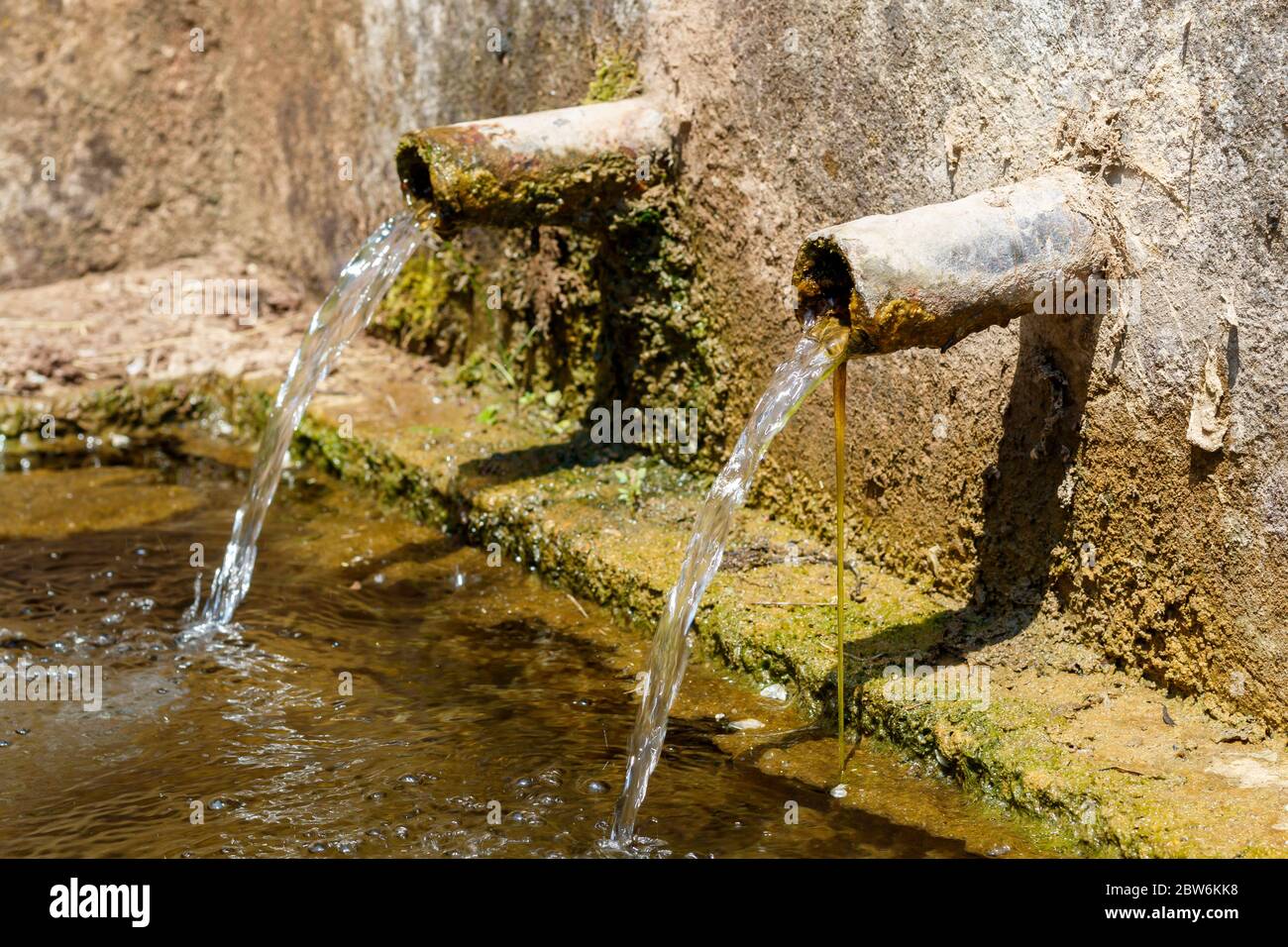 Water Flowing From Old Weathered Fountain Stock Photo - Alamy
