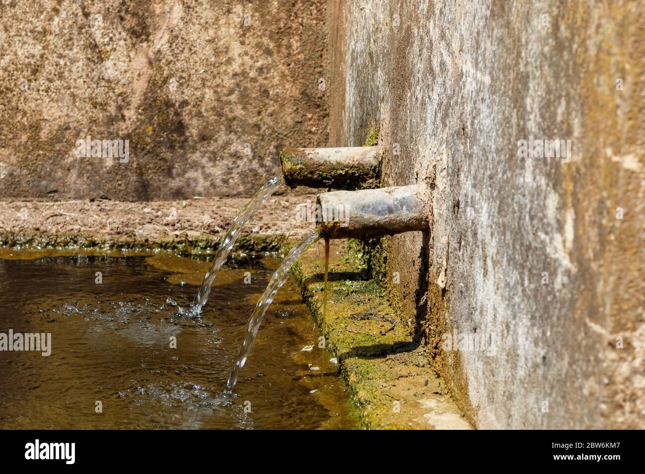 Water Flowing From Old Weathered Fountain Stock Photo - Alamy