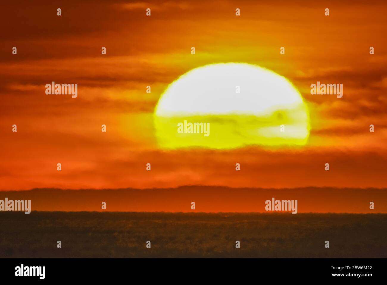 Sunset in the desert Stock Photo - Alamy