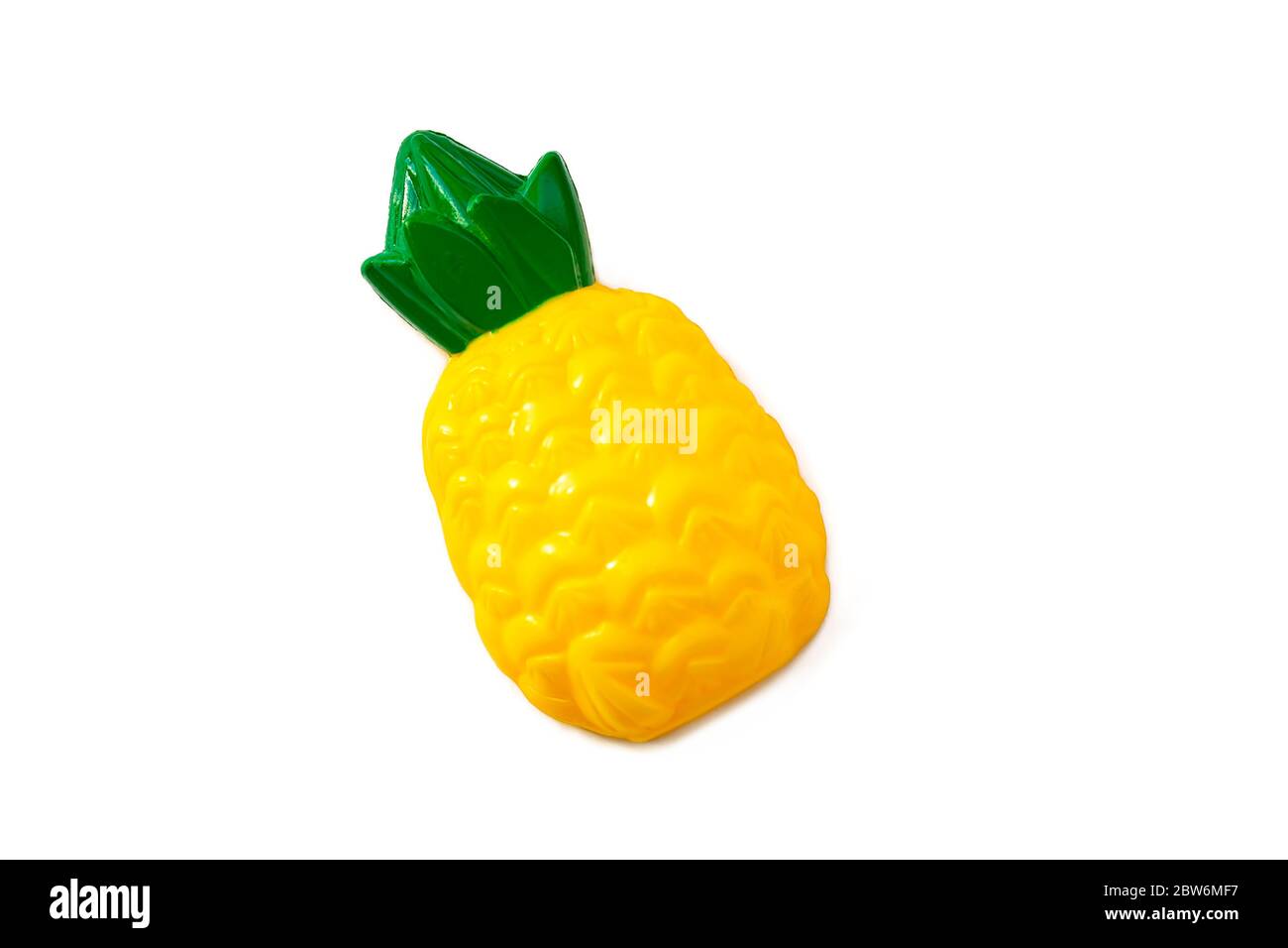 Pineapple. Toy plastic fruit isolated on white background. Plastic ...