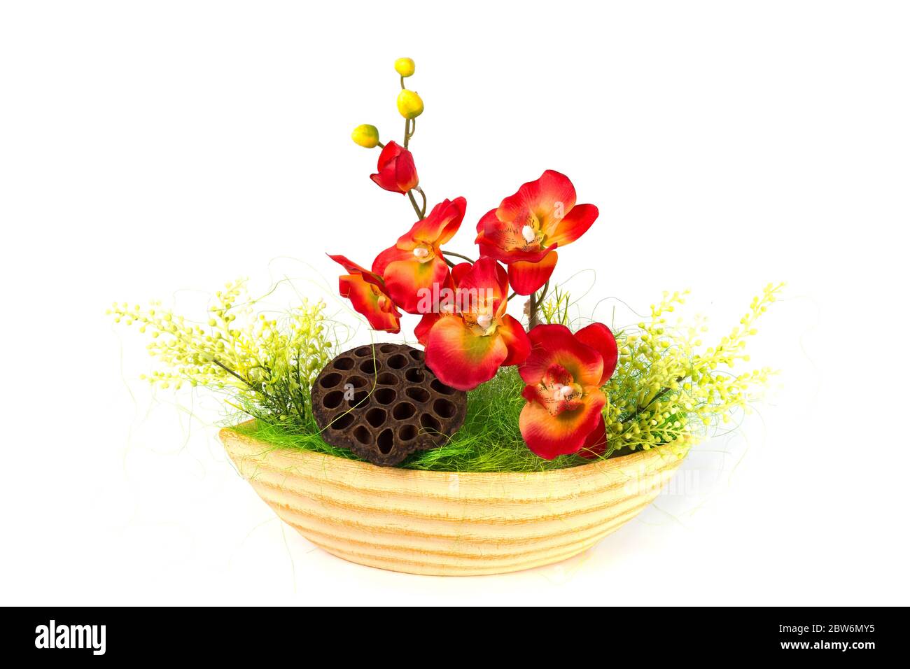 Composition with artificial flowers in a pot isolated on white ...