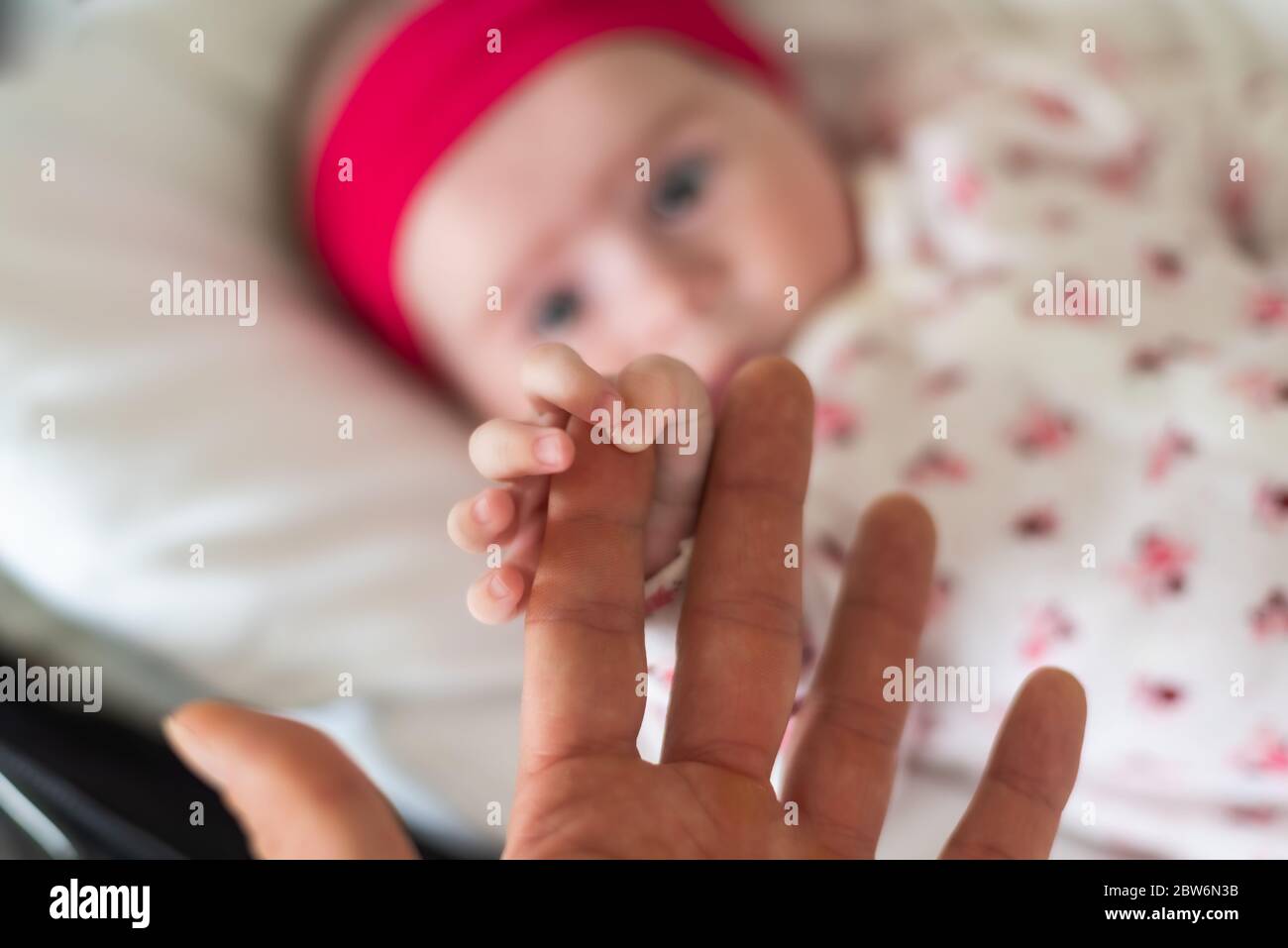Baby hand grab hi-res stock photography and images - Alamy