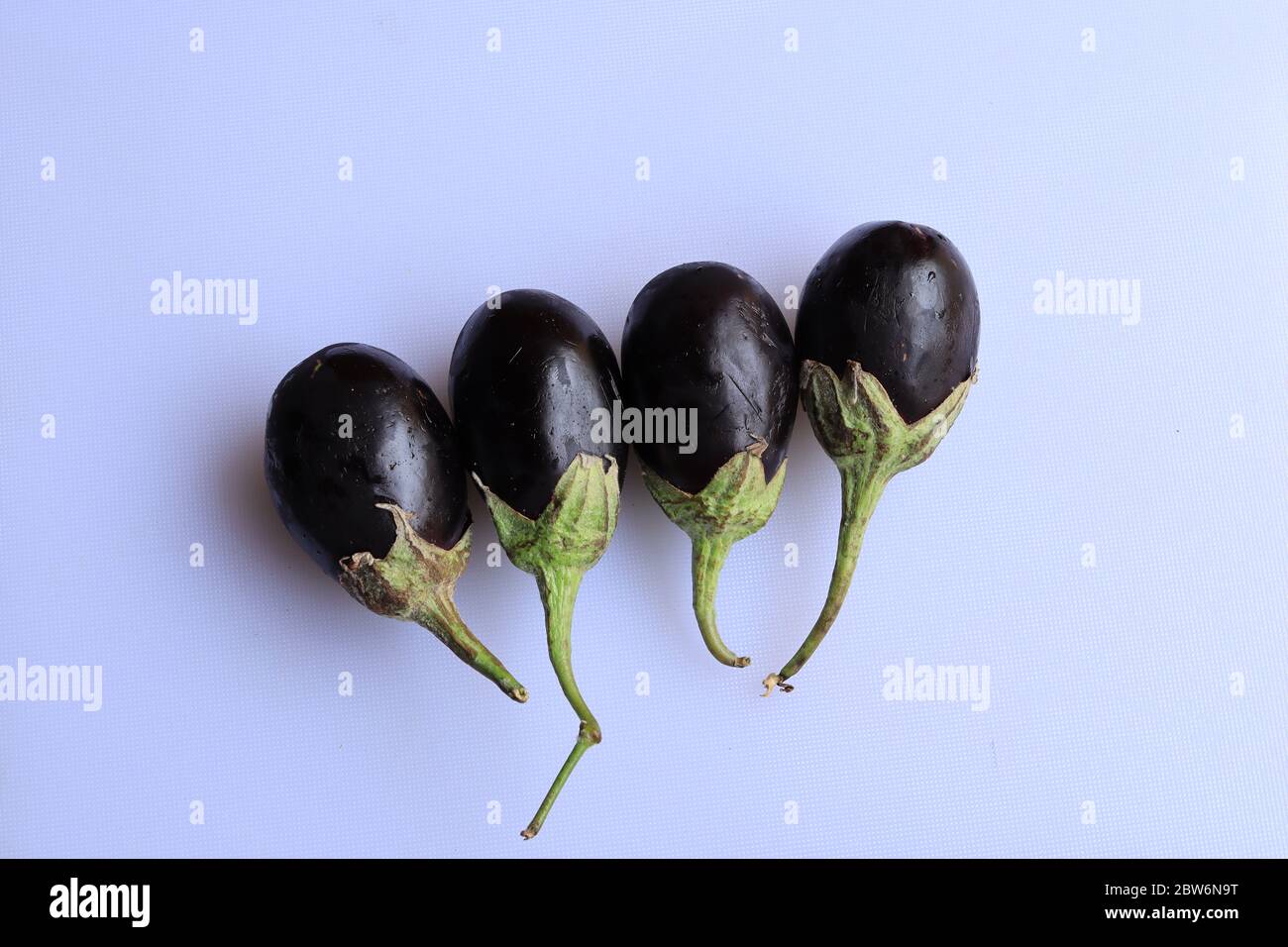 Fresh Raw Sliced Purple Eggplant Brinjal or Eggplant isolated on white ...