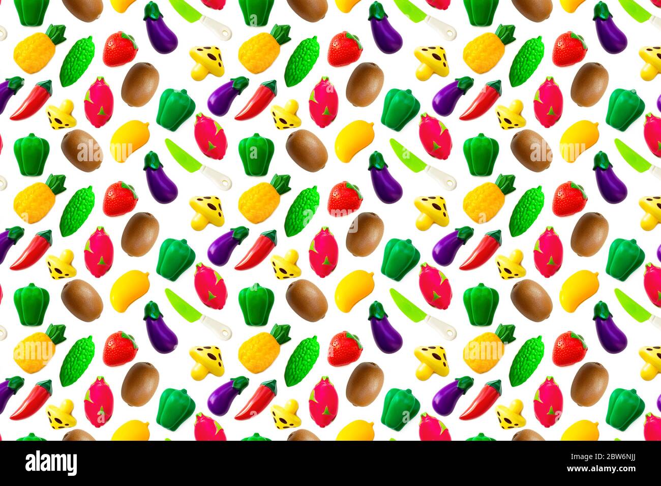 Pattern. Toy plastic fruits and vegetable collection set isolated on ...