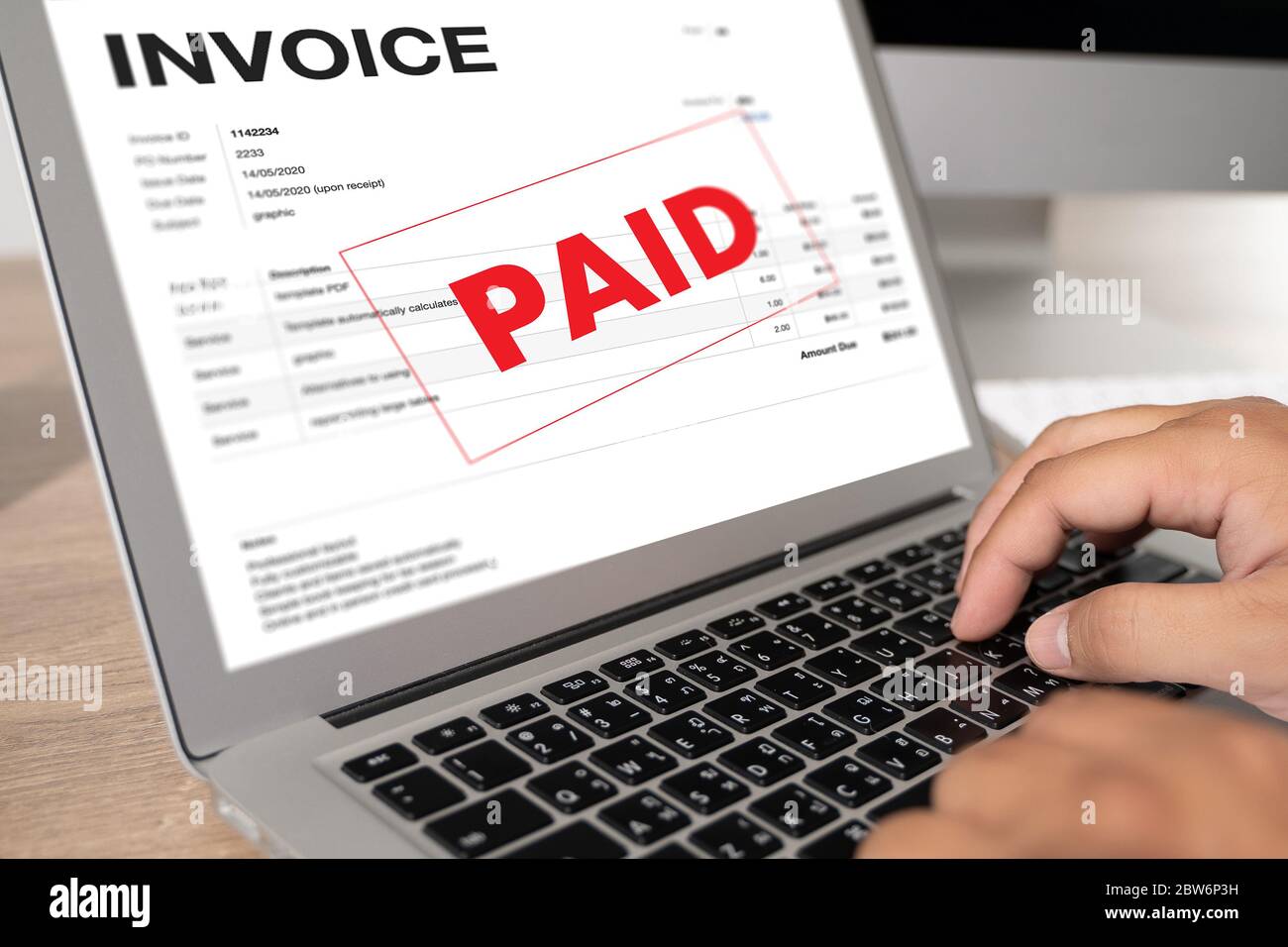 Businessman work Using The Computer Calculating Invoice In Office ...
