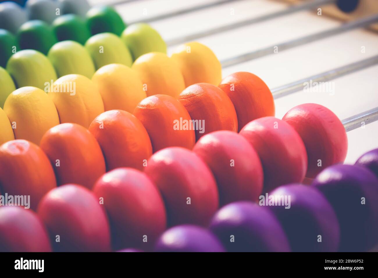 Multi-colored designer background. Calculating Colorful wooden rainbow ...