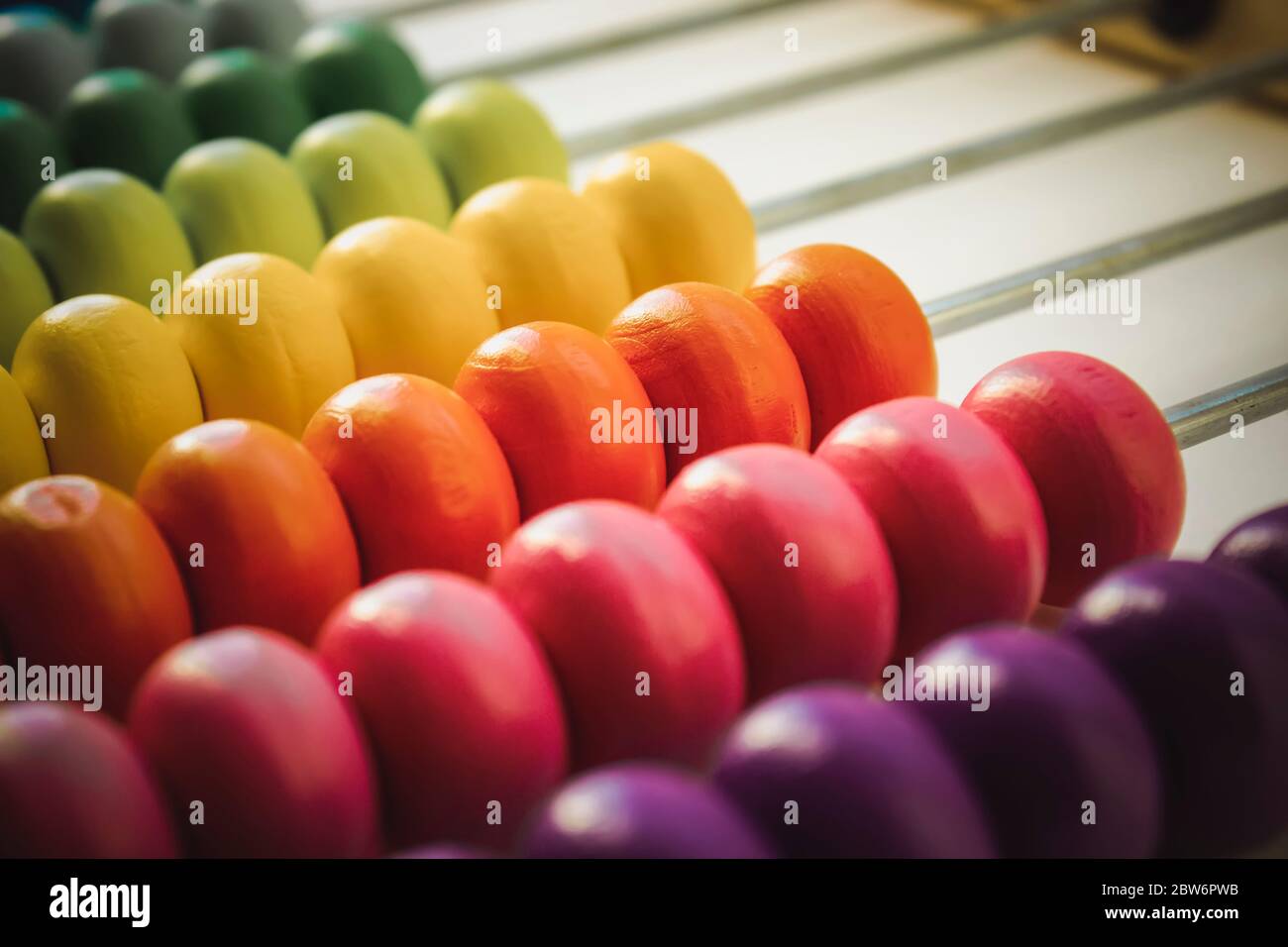 Multi-colored designer background. Calculating Colorful wooden rainbow ...