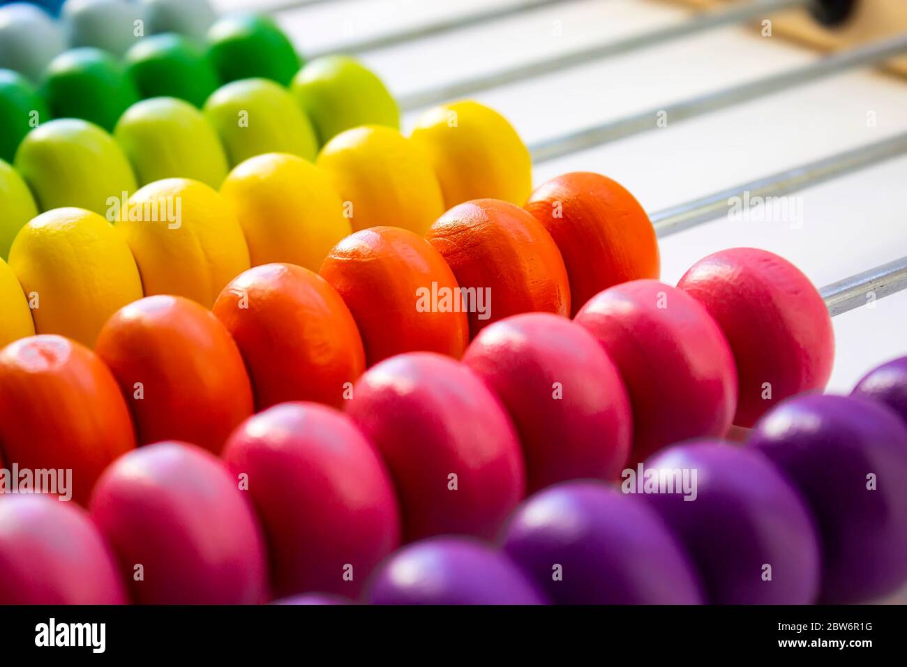 Multi-colored designer background. Calculating Colorful wooden rainbow ...