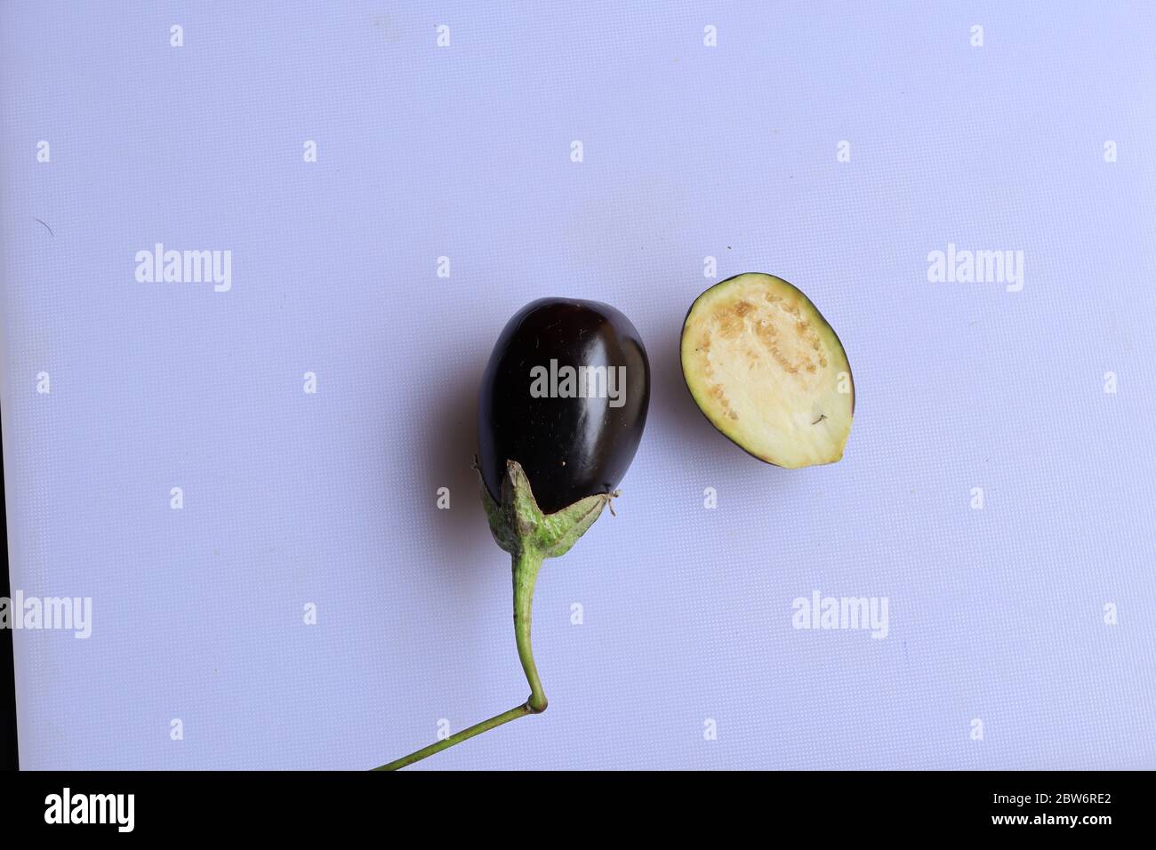 Fresh Raw Sliced Purple Eggplant Brinjal or Eggplant isolated on white ...