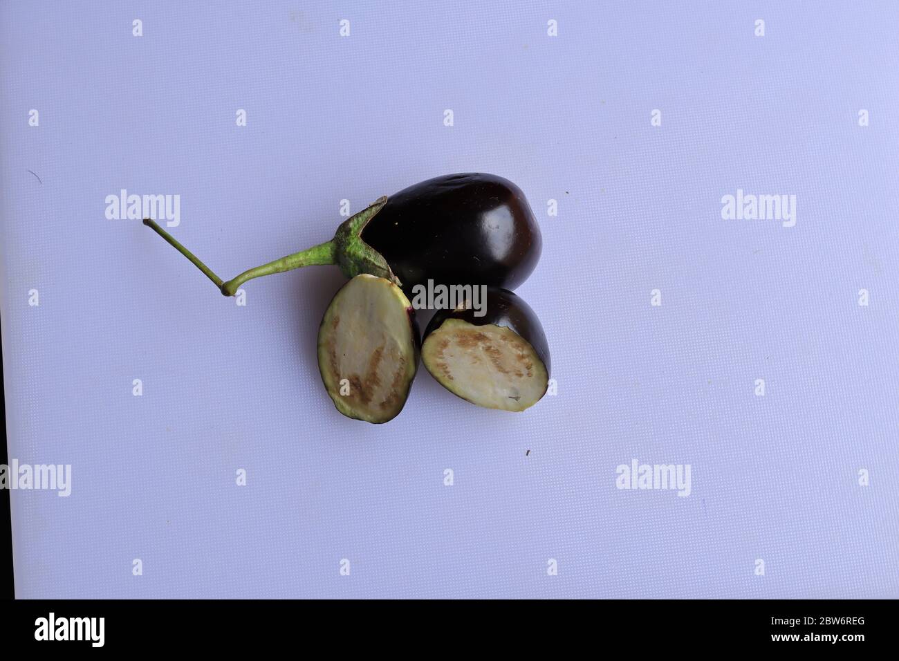 Fresh Raw Sliced Purple Eggplant Brinjal or Eggplant isolated on white ...