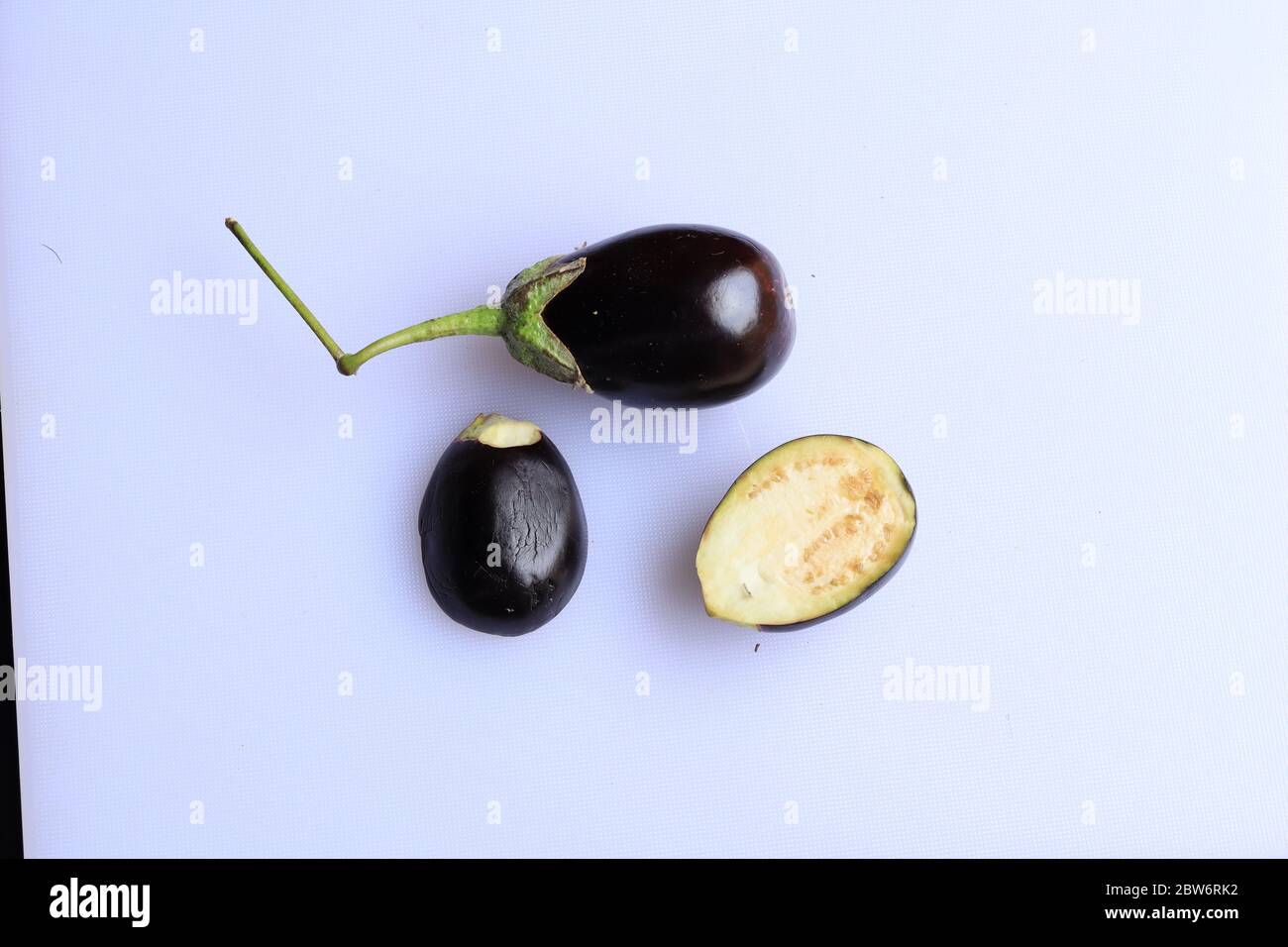 Fresh Raw Sliced Purple Eggplant Brinjal or Eggplant isolated on white ...
