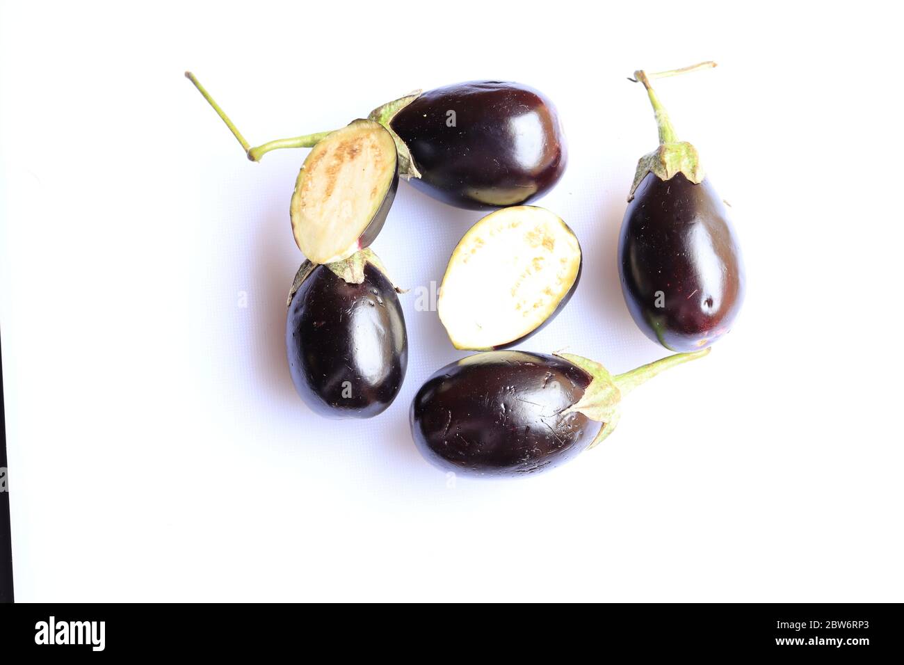 Fresh Raw Sliced Purple Eggplant Brinjal or Eggplant isolated on white ...