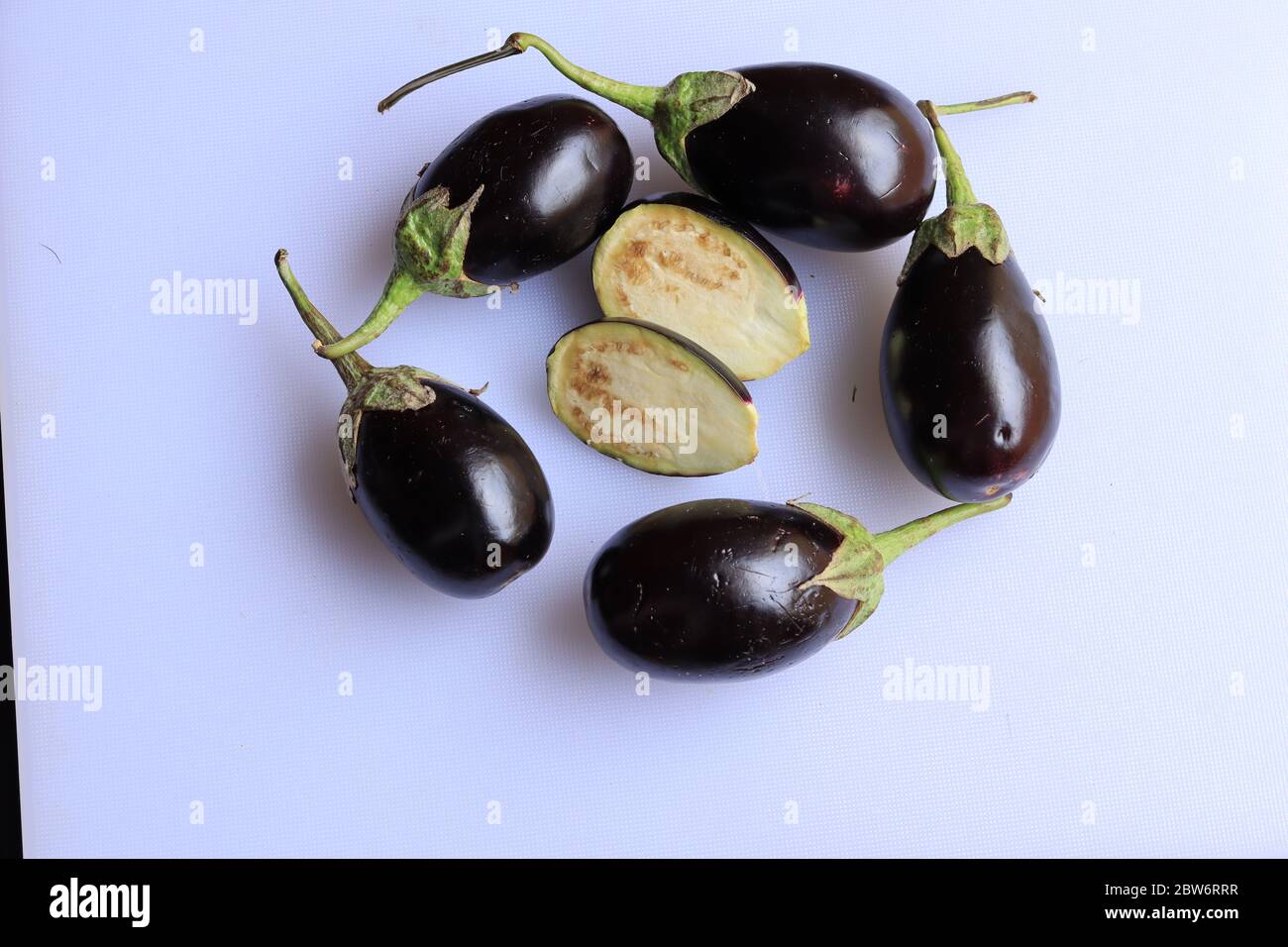 Fresh Raw Sliced Purple Eggplant Brinjal or Eggplant isolated on white ...