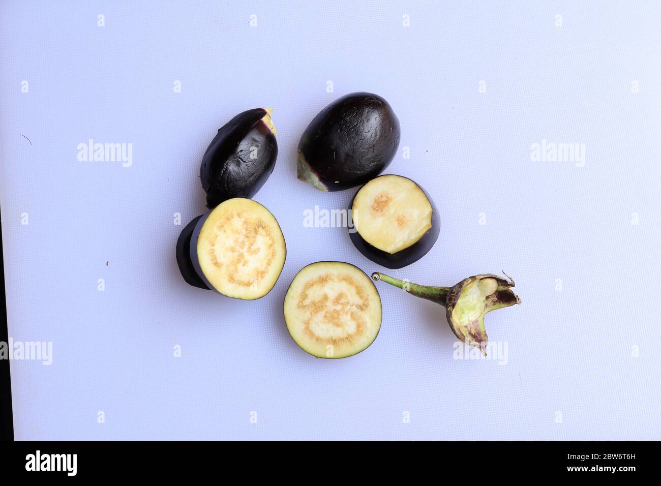 Fresh Raw Sliced Purple Eggplant Brinjal or Eggplant isolated on white ...