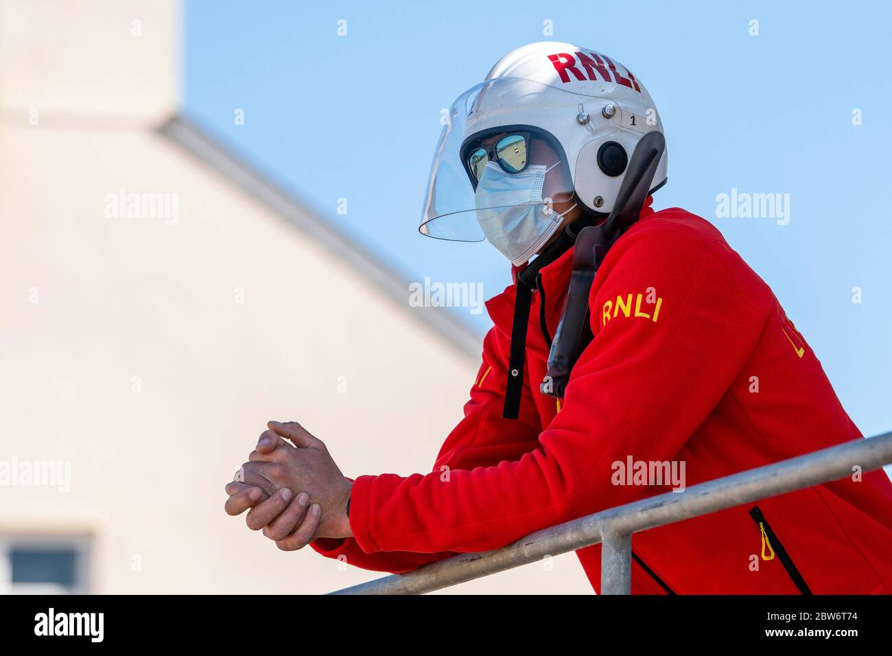RNLI Lifeguards resume patrols on the beach at Croyde in Devon wearing ...
