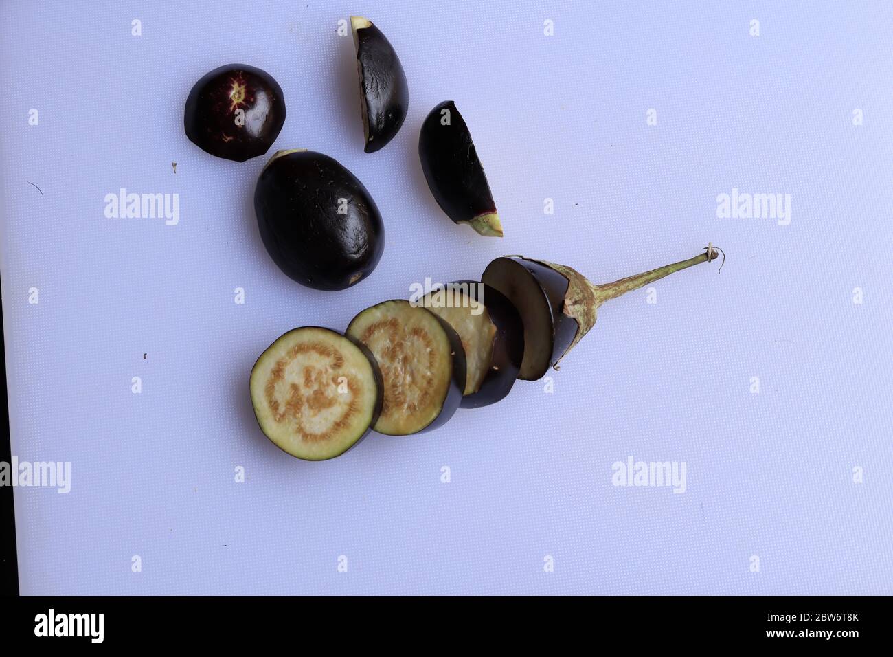 Fresh Raw Sliced Purple Eggplant Brinjal or Eggplant isolated on white ...
