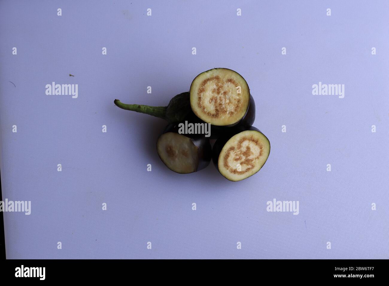 Fresh Raw Sliced Purple Eggplant Brinjal or Eggplant isolated on white ...
