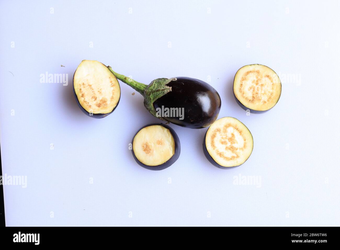 Fresh Raw Sliced Purple Eggplant Brinjal or Eggplant isolated on white ...