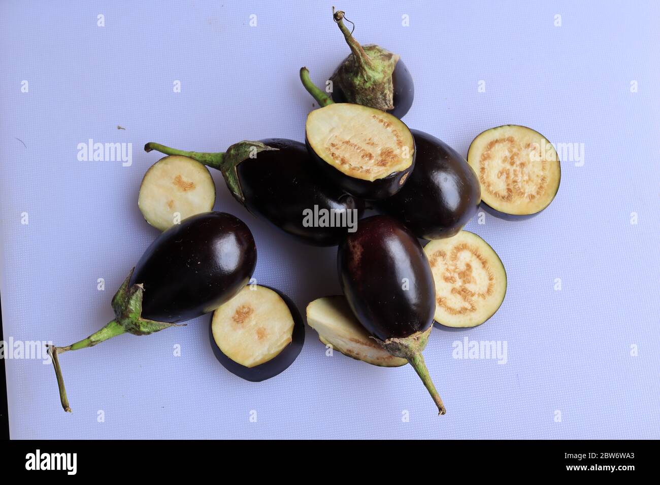 Fresh Raw Sliced Purple Eggplant Brinjal or Eggplant isolated on white ...