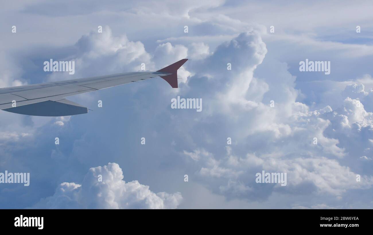 Storm clouds and part of the wing of the aircraft window Stock Photo ...